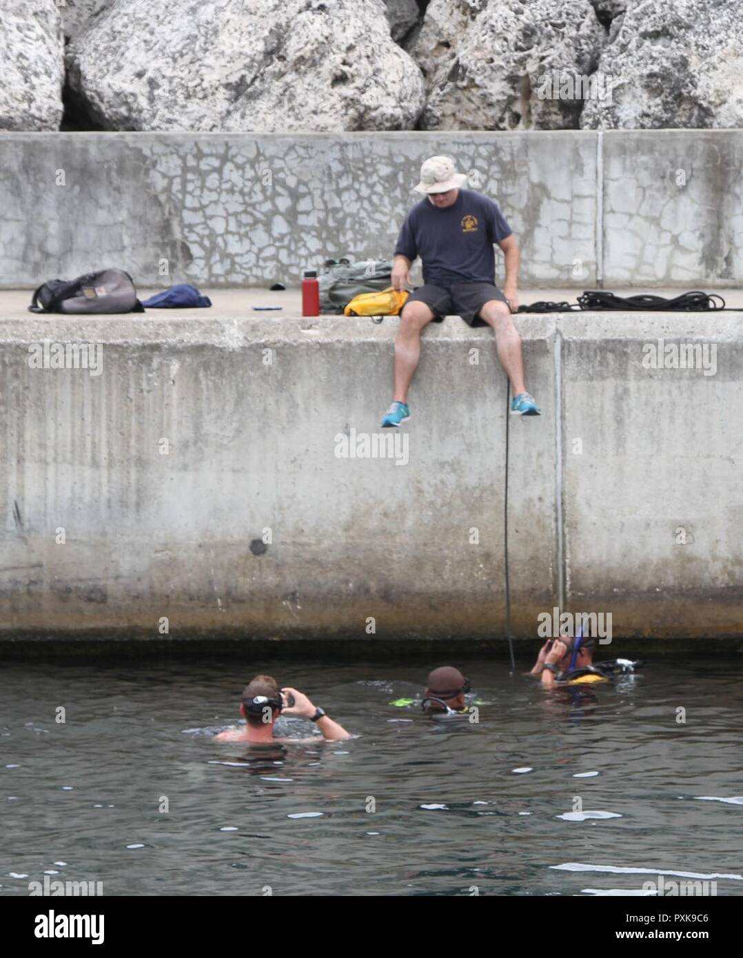 United States Navy Petty Officer 1st Class Daniel Franke guides Navy ...