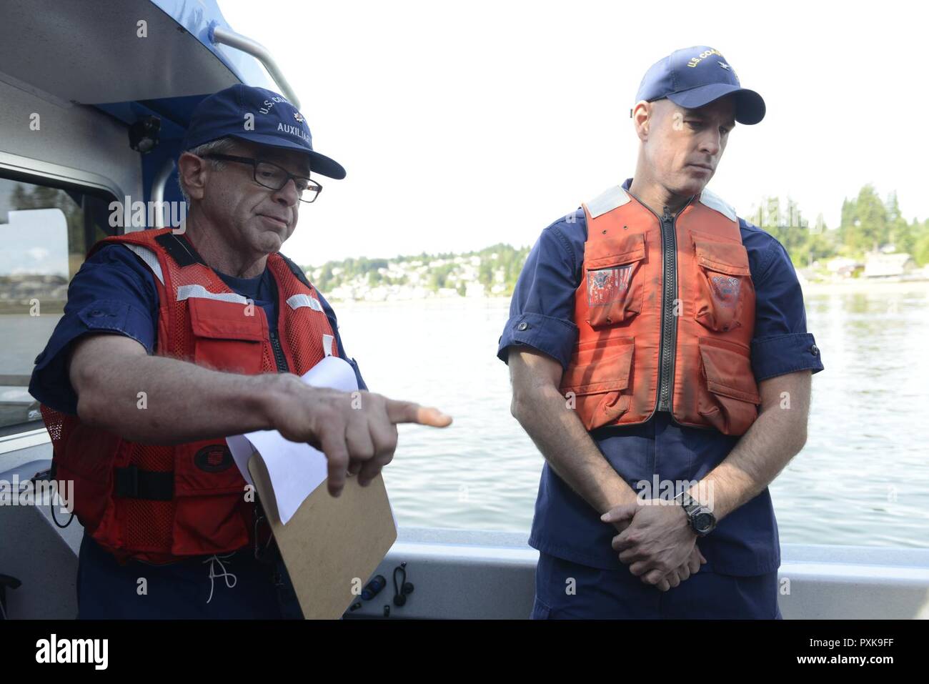 Capt. Sean Cross (right), chief of response, Coast Guard 13th District ...
