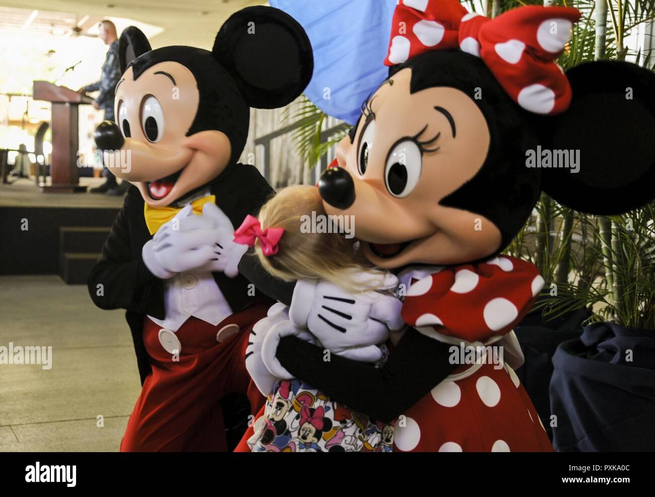 Mickey and Minnie Mouse take photos with fans during the Books on Bases ...