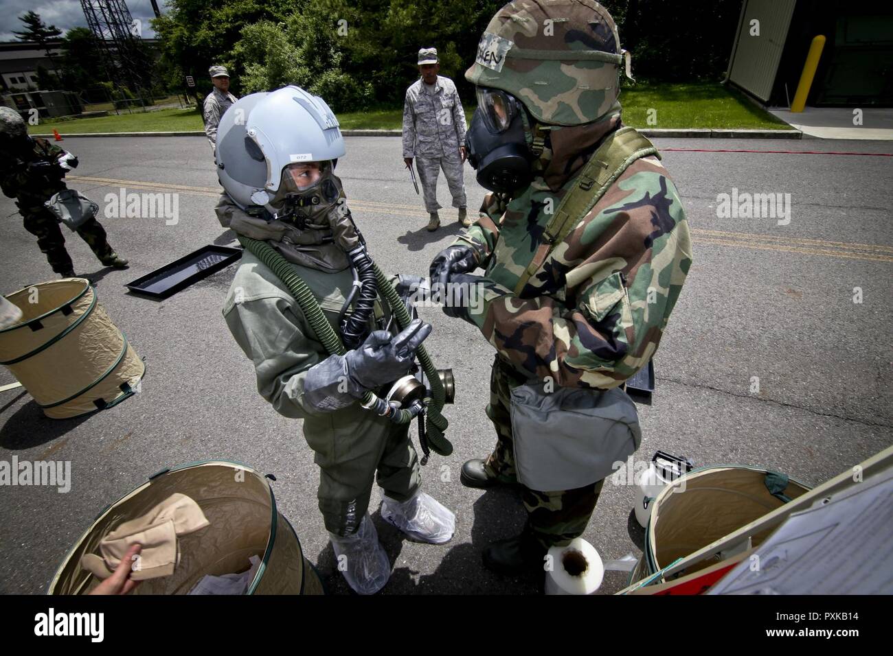 U.S. Air Force Staff Sgt. Brett Van Deren, right, processes Senior ...