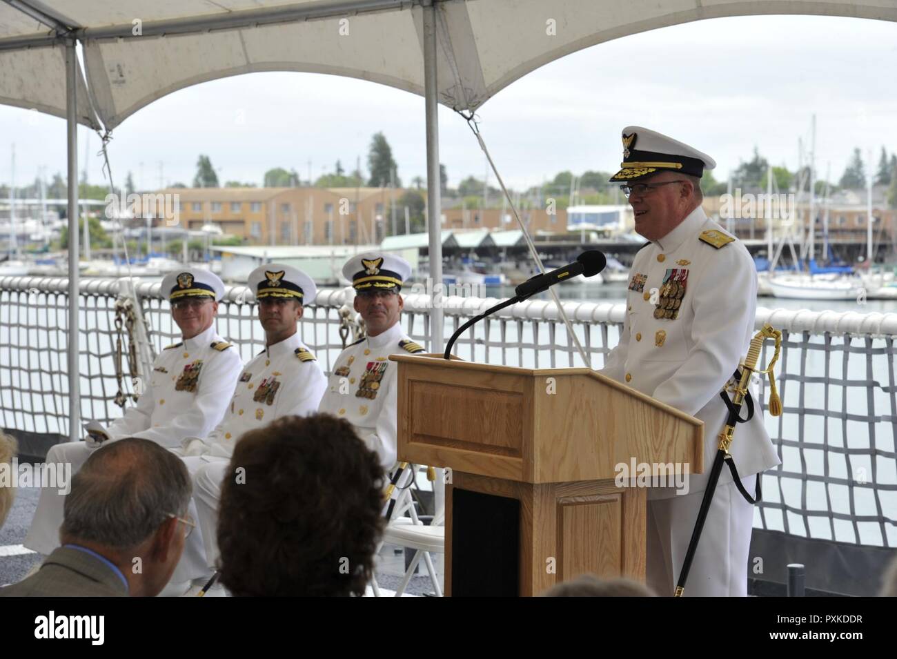 Coast Guard Pacific Area Commander Vice Adm. Fred Midgette (at podium ...