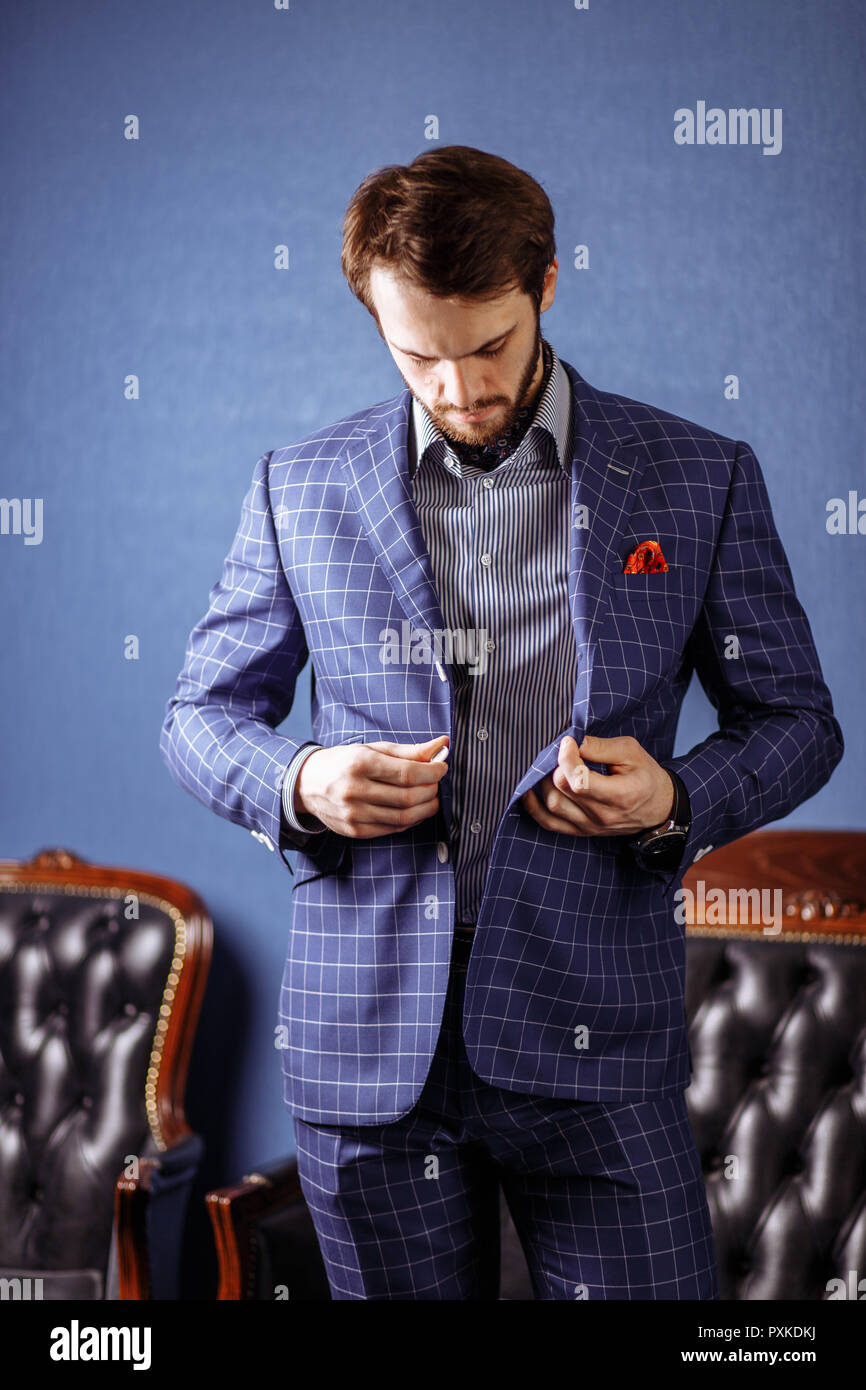 Suit buttoning businessman attractive hi-res stock photography and ...