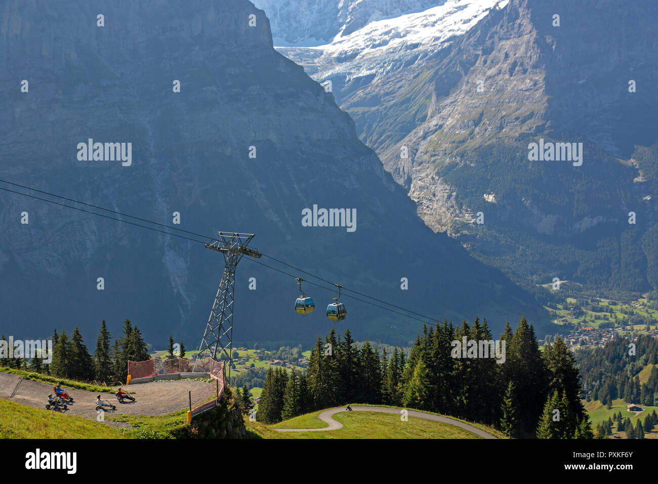 Mountain carts below the First cable car above Grindelwald Stock Photo ...