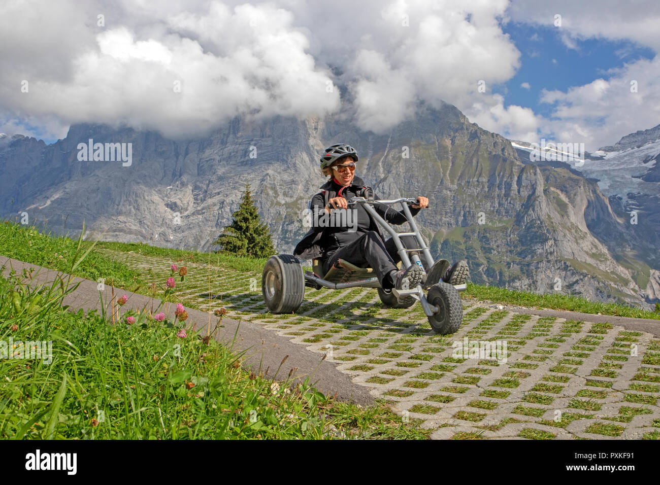 Riding a mountain cart from First cable-car station above Grindelwald ...
