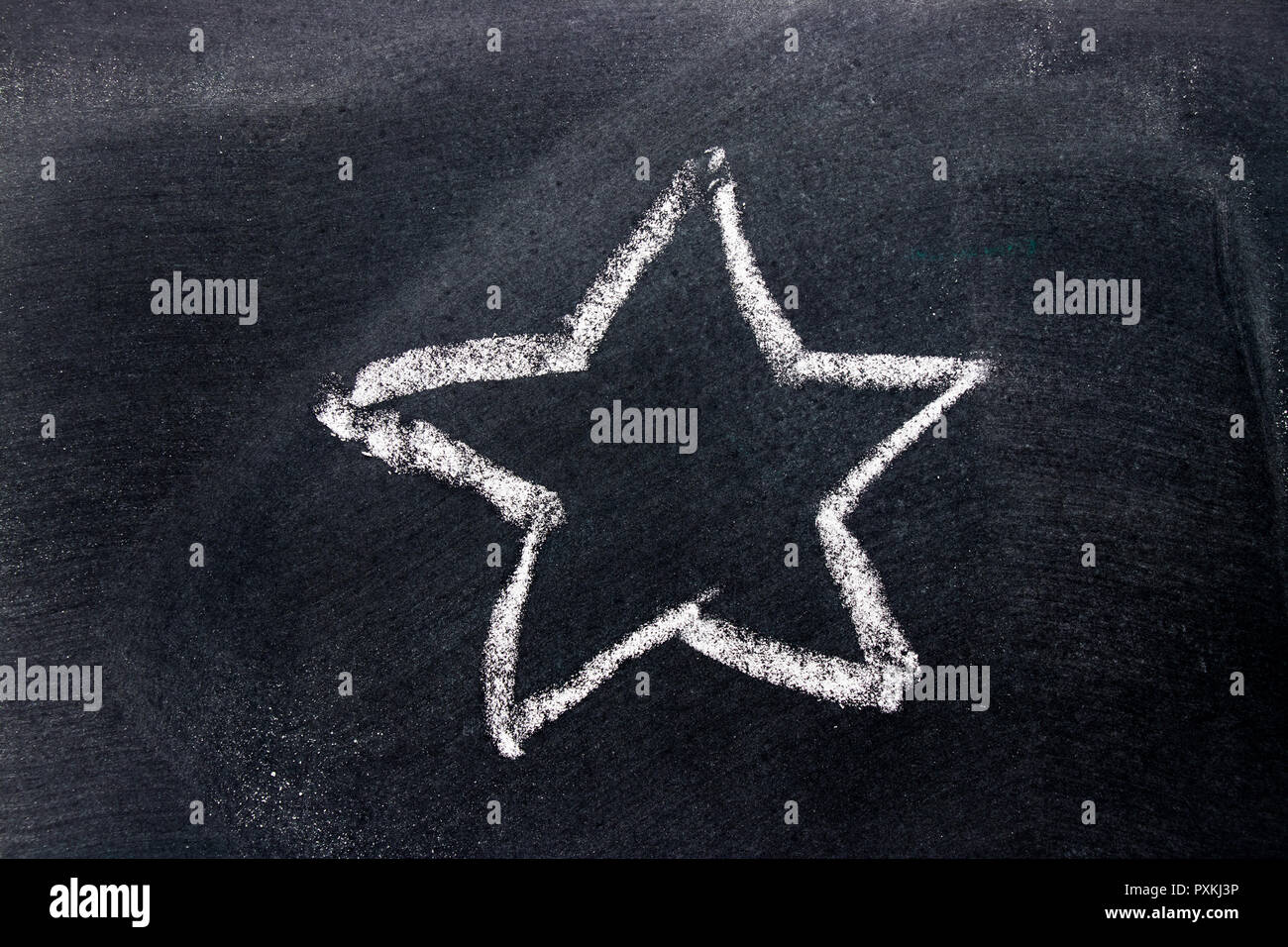 White chalk hand drawing as star shape on black board background Stock ...