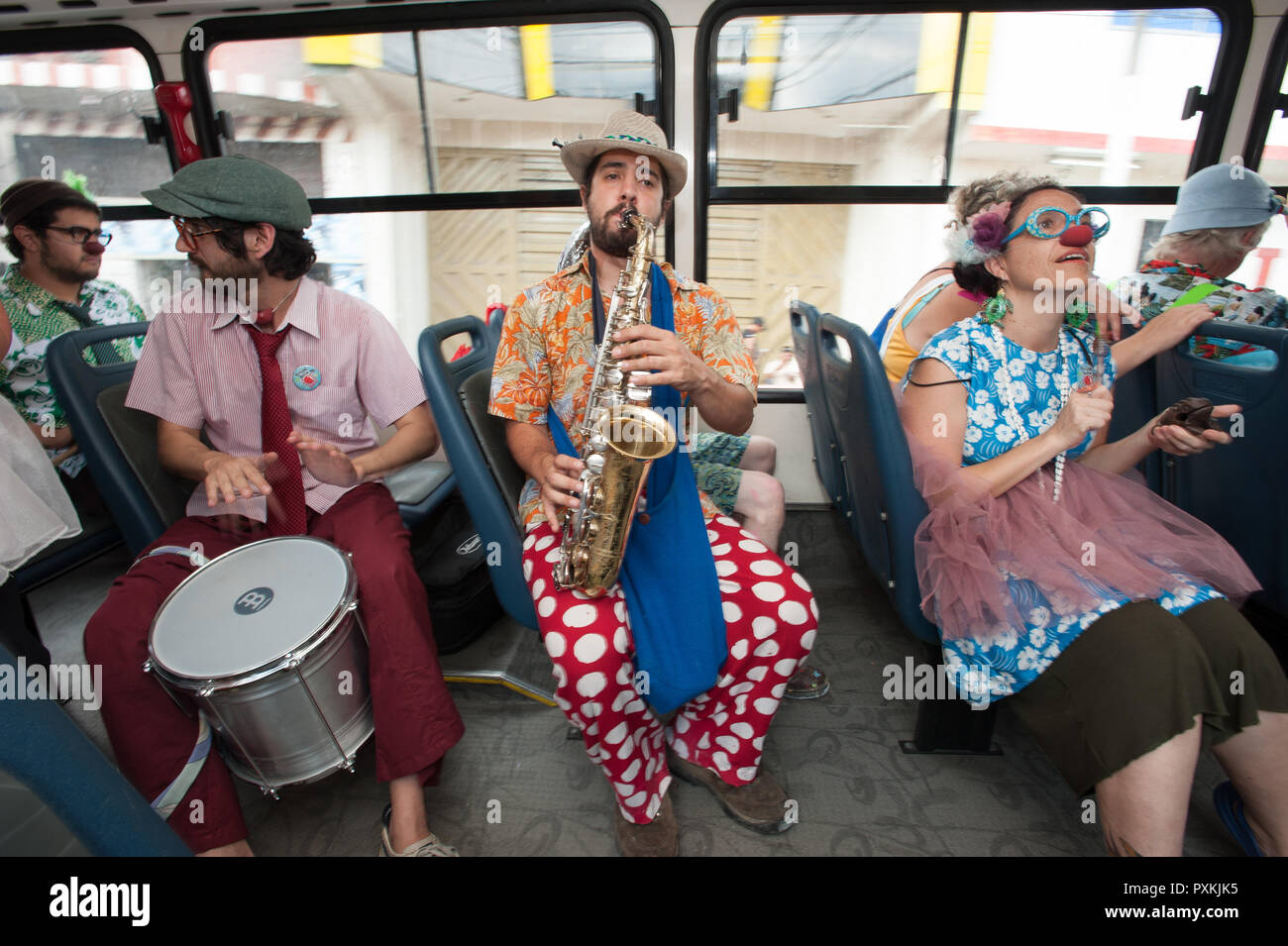 The group clowns on the bus that takes them in various places to visit ...