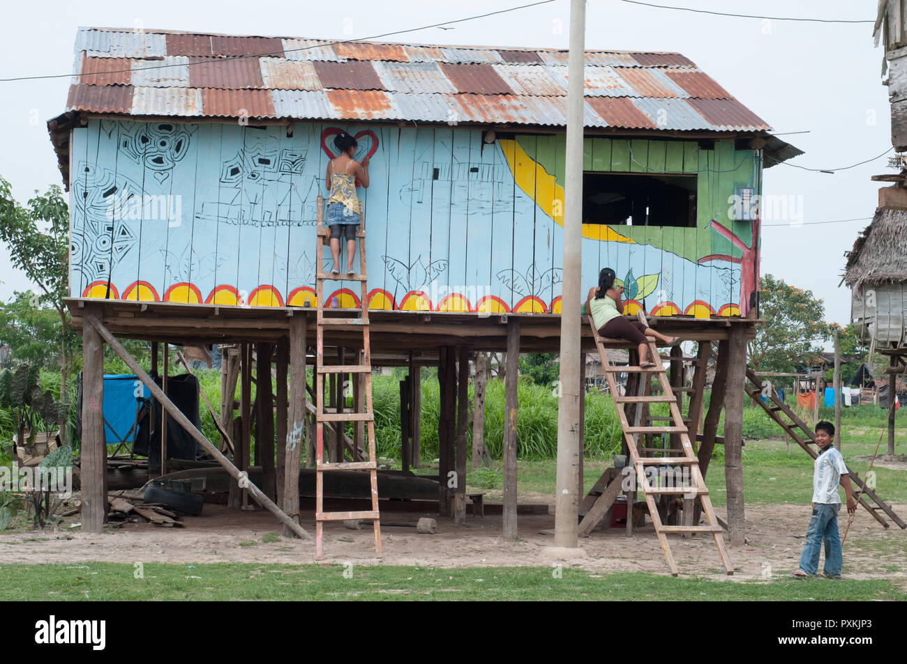 Painting the houses in Belen during the festival Stock Photo - Alamy