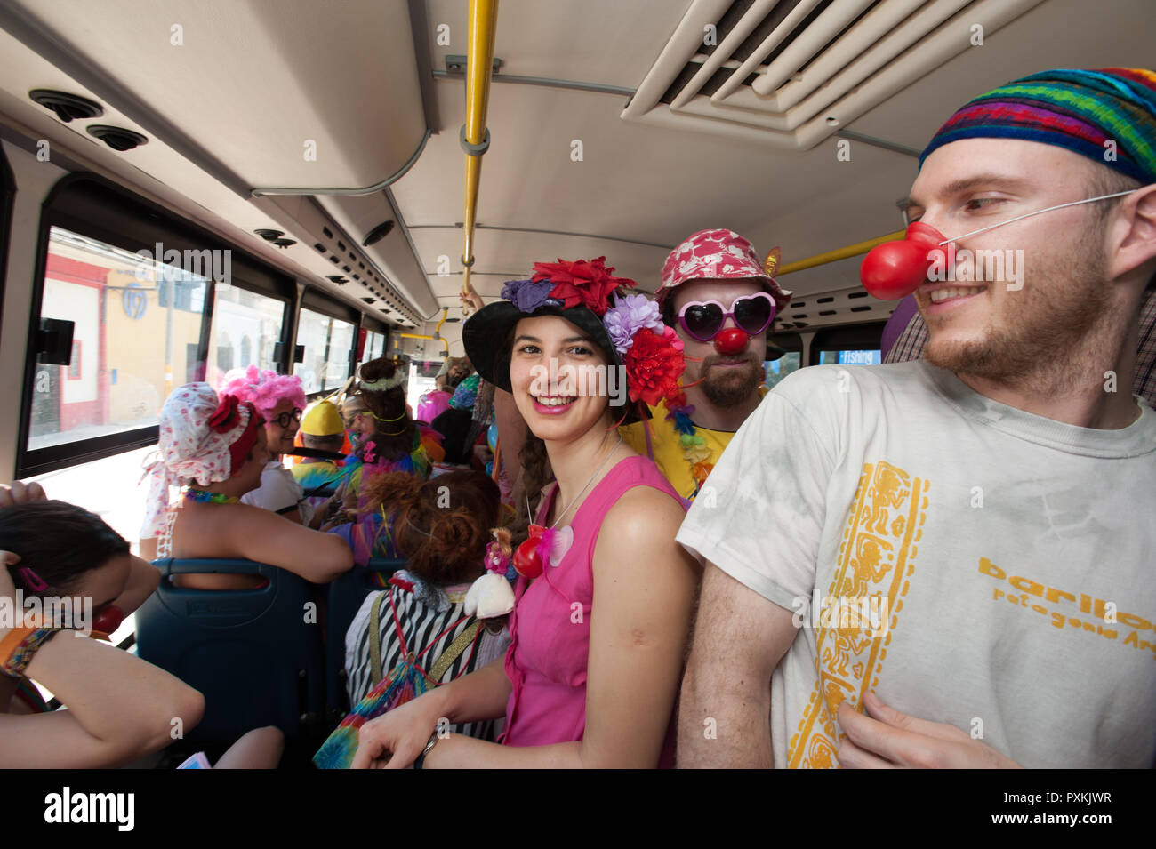 The group clowns on the bus that takes them in various places to visit ...