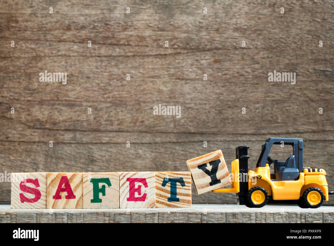 Toy plastic forklift hold block Y to compose and fulfill wording safety ...