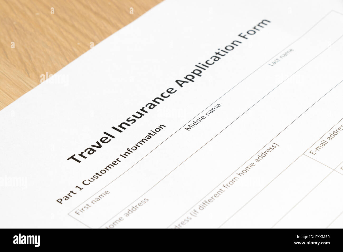 Travel insurance application form wait to fill information on desk ...