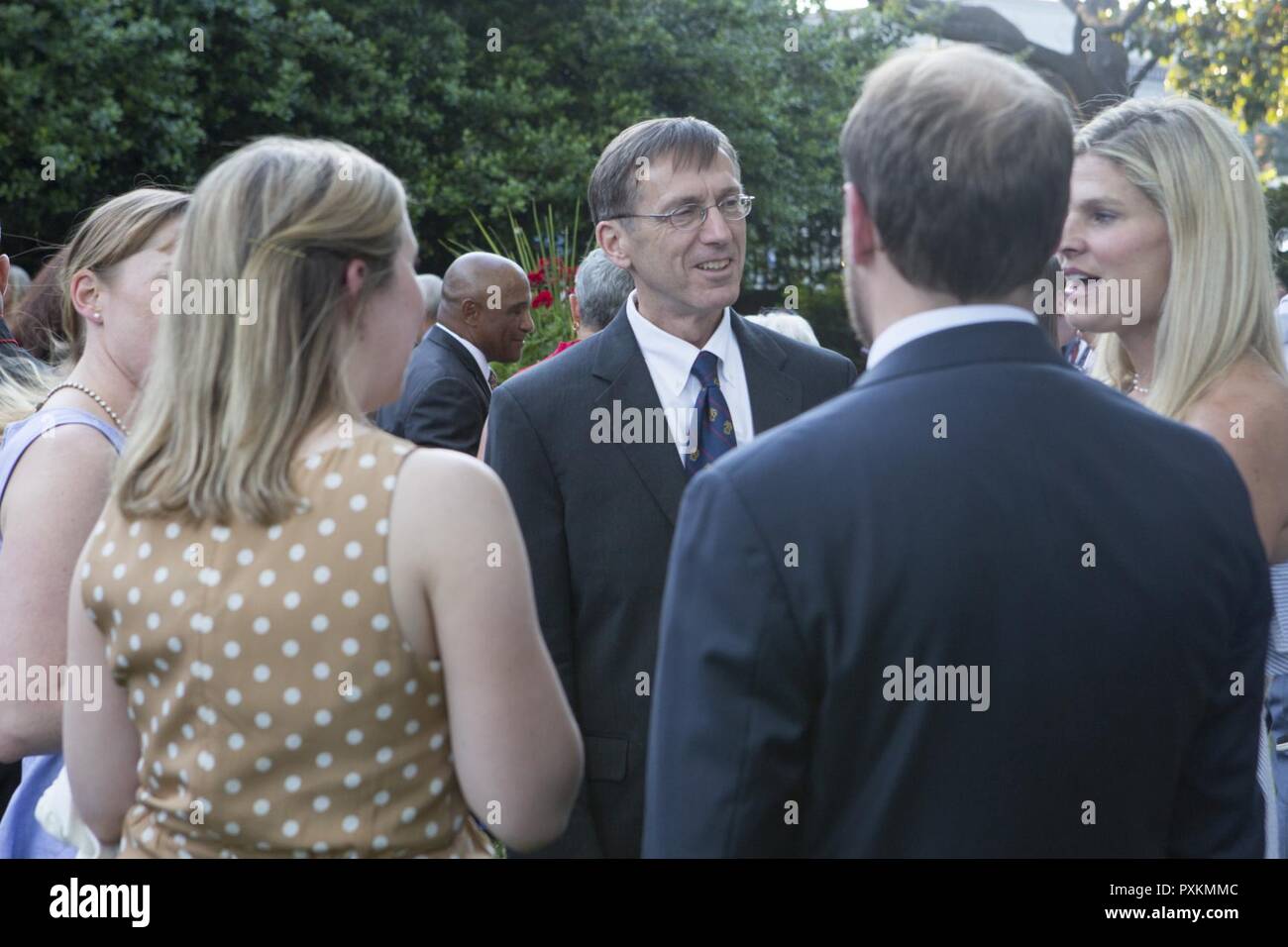 Secretary of the Navy the Honorable Sean J. Stackley, center, speaks to ...