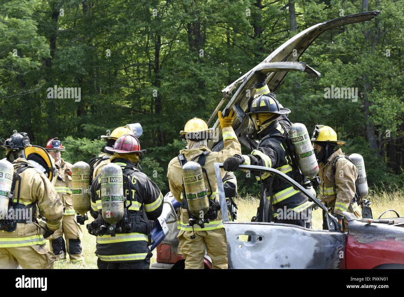 Fire fighters with the 449th Fire Fighting team use the jaws of life to ...