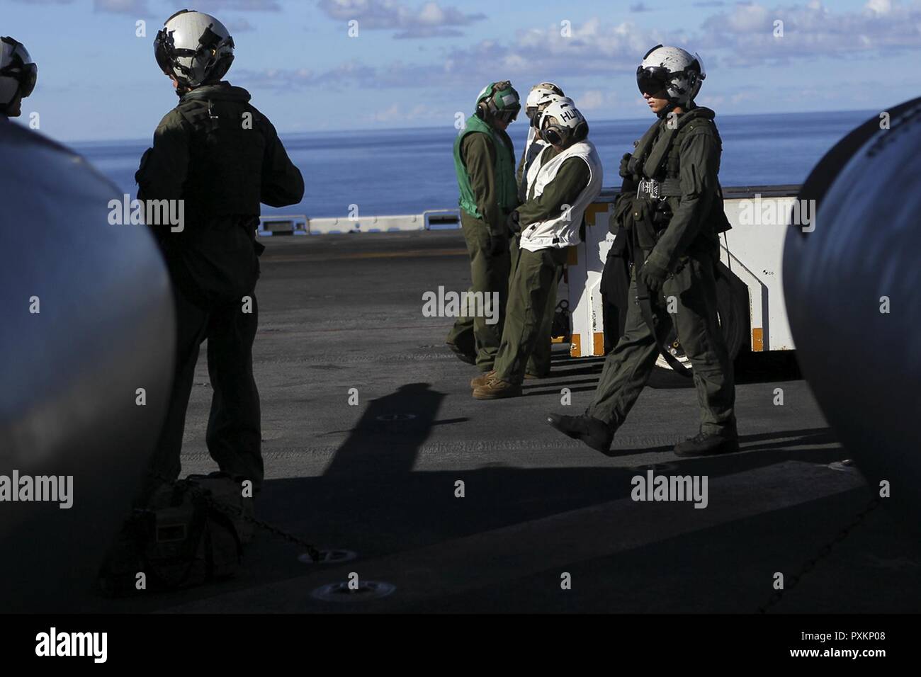 Marines with Marine Attack Squadron 311 wait on the flight deck during ...