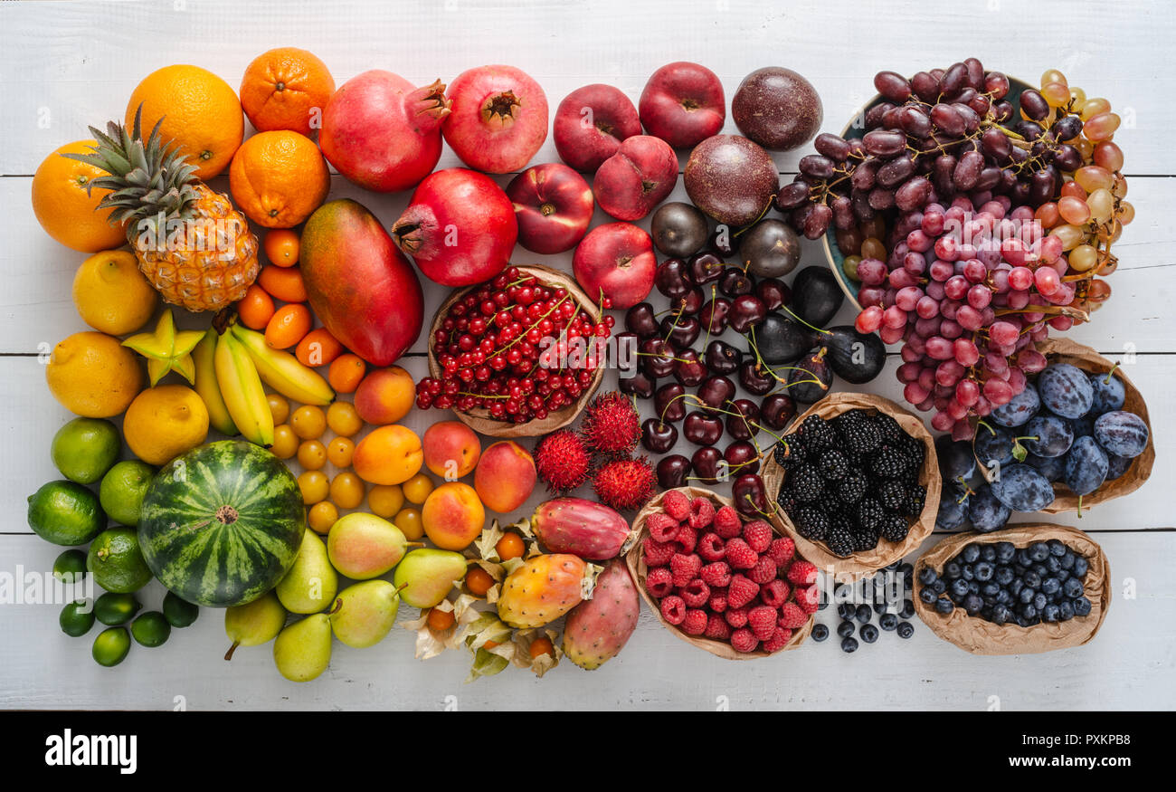 Fruits, Selection of Fruits on white wood panelling Stock Photo - Alamy