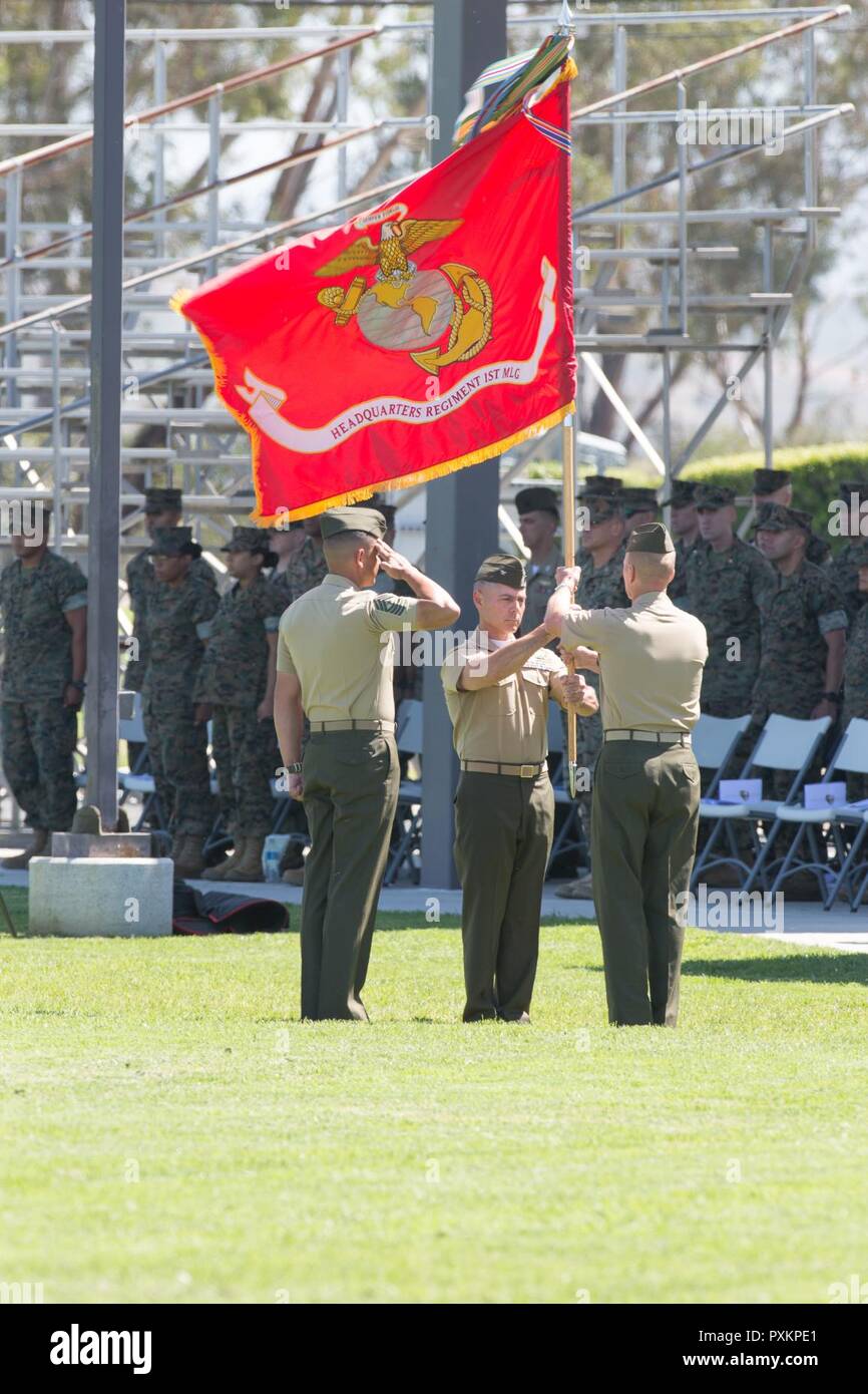 U.S. Marine Col. Phillip N. Frietze exchanges the regimental colors ...