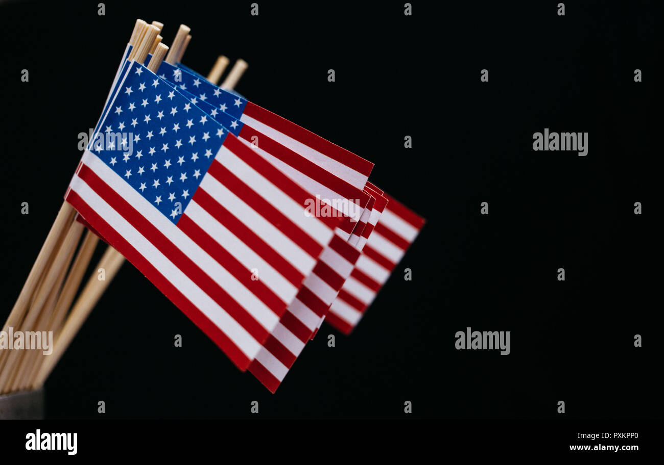 Miniature paper flag USA. American Flag on black background Stock Photo ...