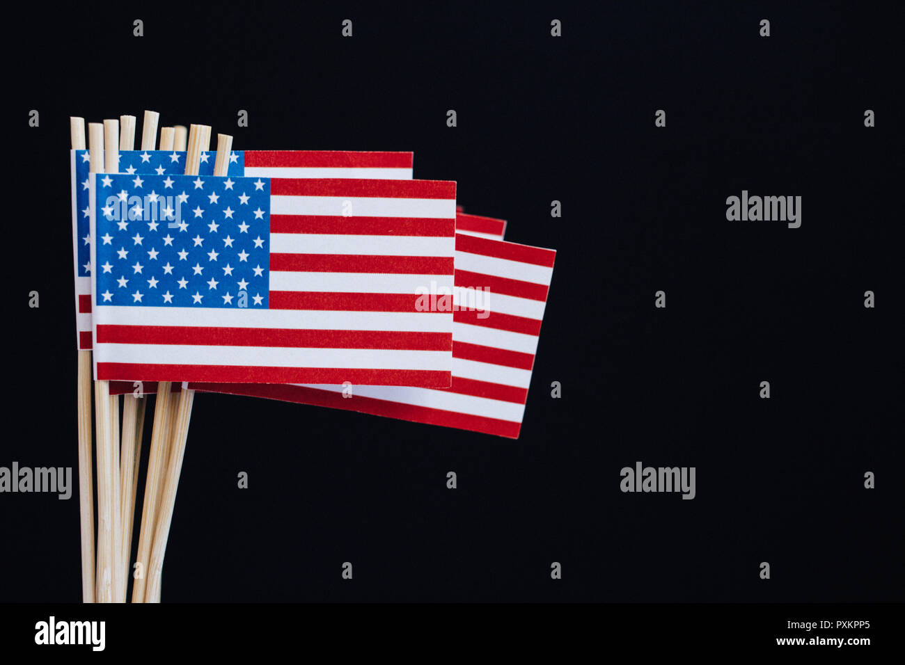 Miniature paper flag USA. American Flag on black background Stock Photo ...