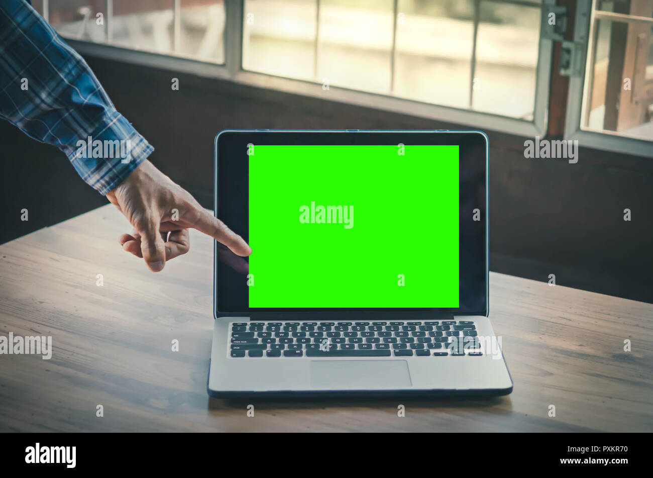 Workplace with notebook laptop Comfortable work table in office windows ...