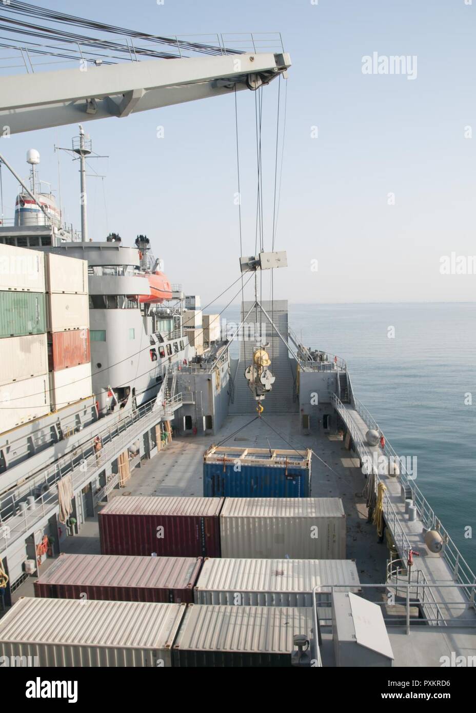 The Military Sealift Command Vessel Gem State transfers a container to ...