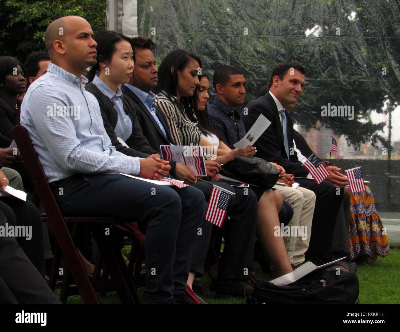 Immigrants in attendance to become naturalized citizens of the United ...