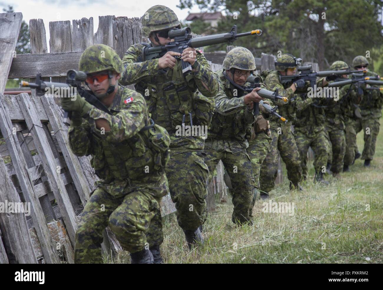 Soldiers of the 3rd Canadian Division, Canadian Army moves in a ...