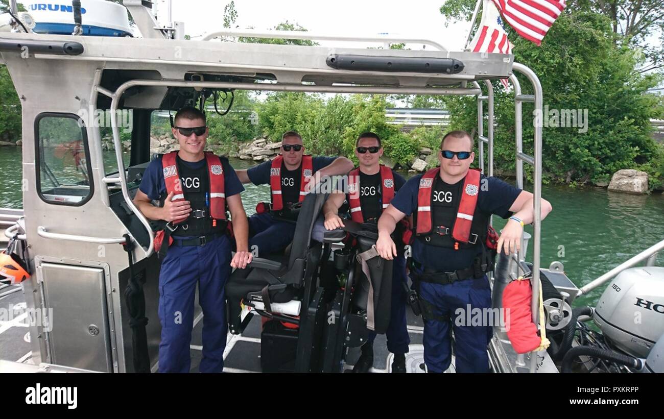 Members of Coast Guard Station St. Clair Shores, Michigan, pose for a ...