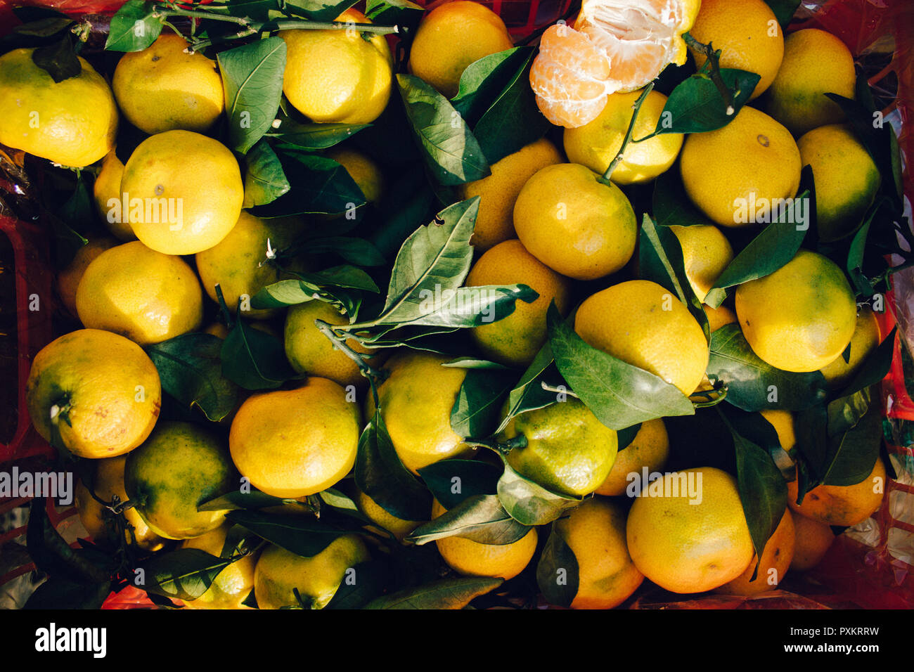 tangerines with green leaves background, fresh fruits Stock Photo - Alamy