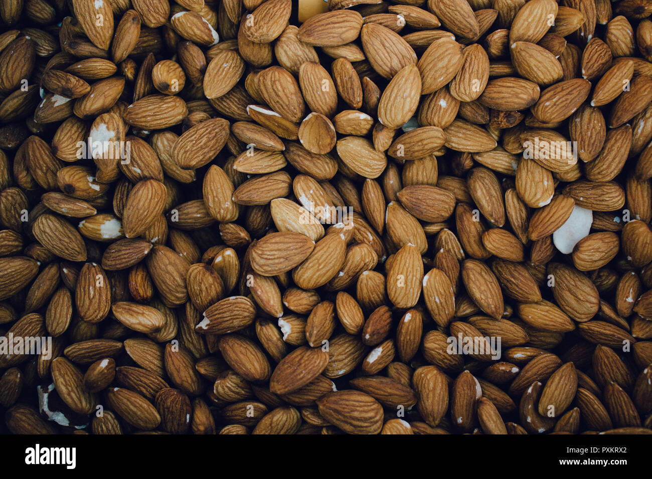 Background of big raw peeled almonds, top view Stock Photo - Alamy