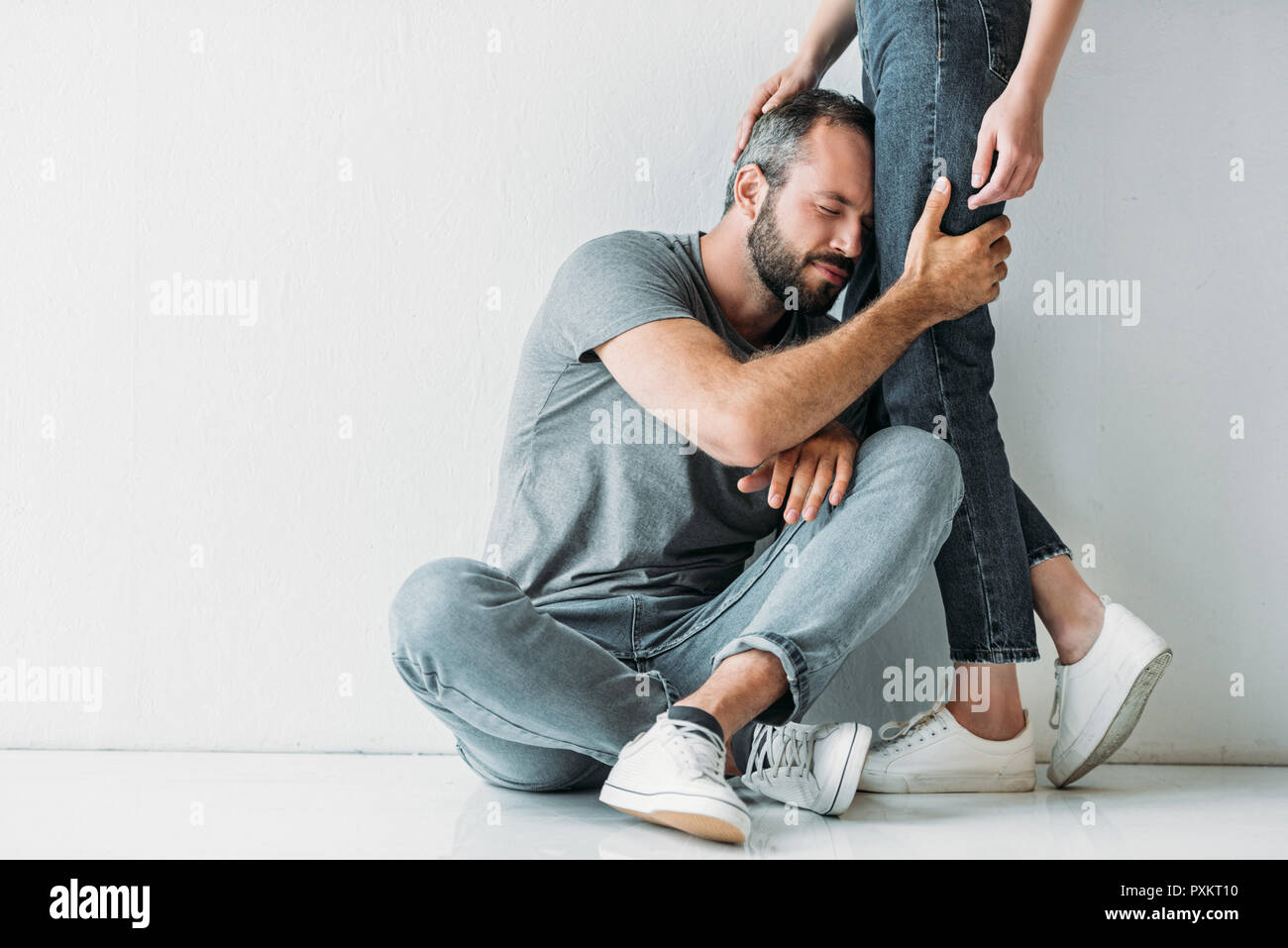 Hugging legs hi-res stock photography and images - Alamy