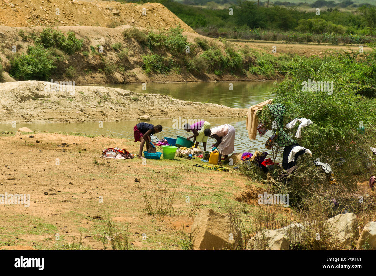 Women washing in river hi-res stock photography and images - Alamy