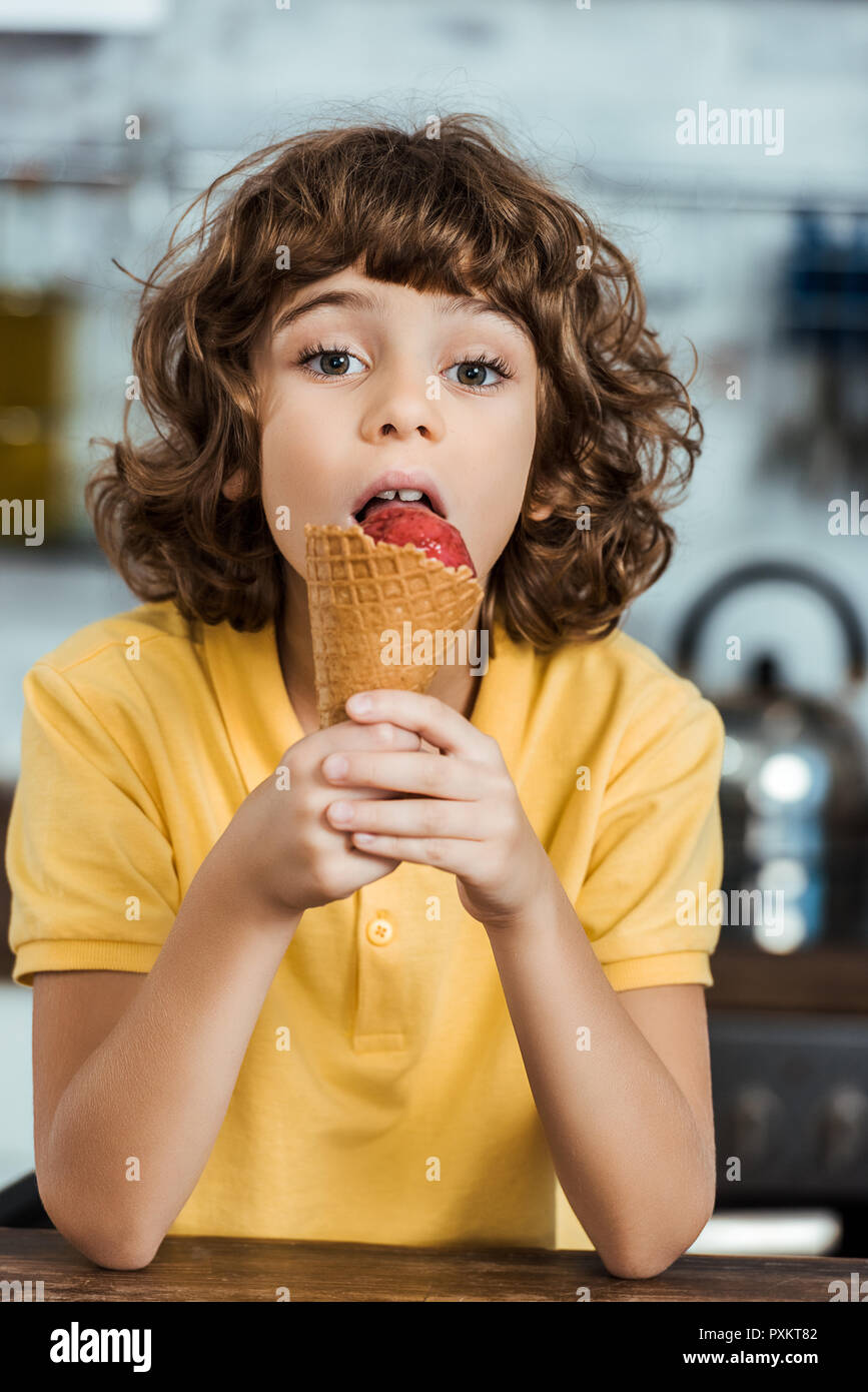 Preteen boy eating ice cream hi-res stock photography and images - Alamy