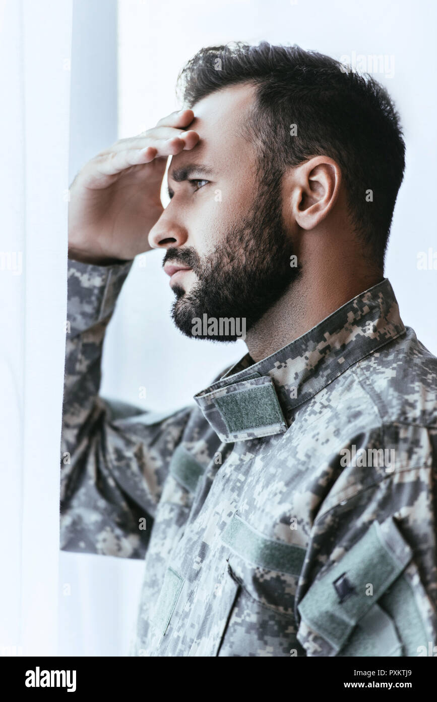 depressed army man in military uniform with post-traumatic stress ...