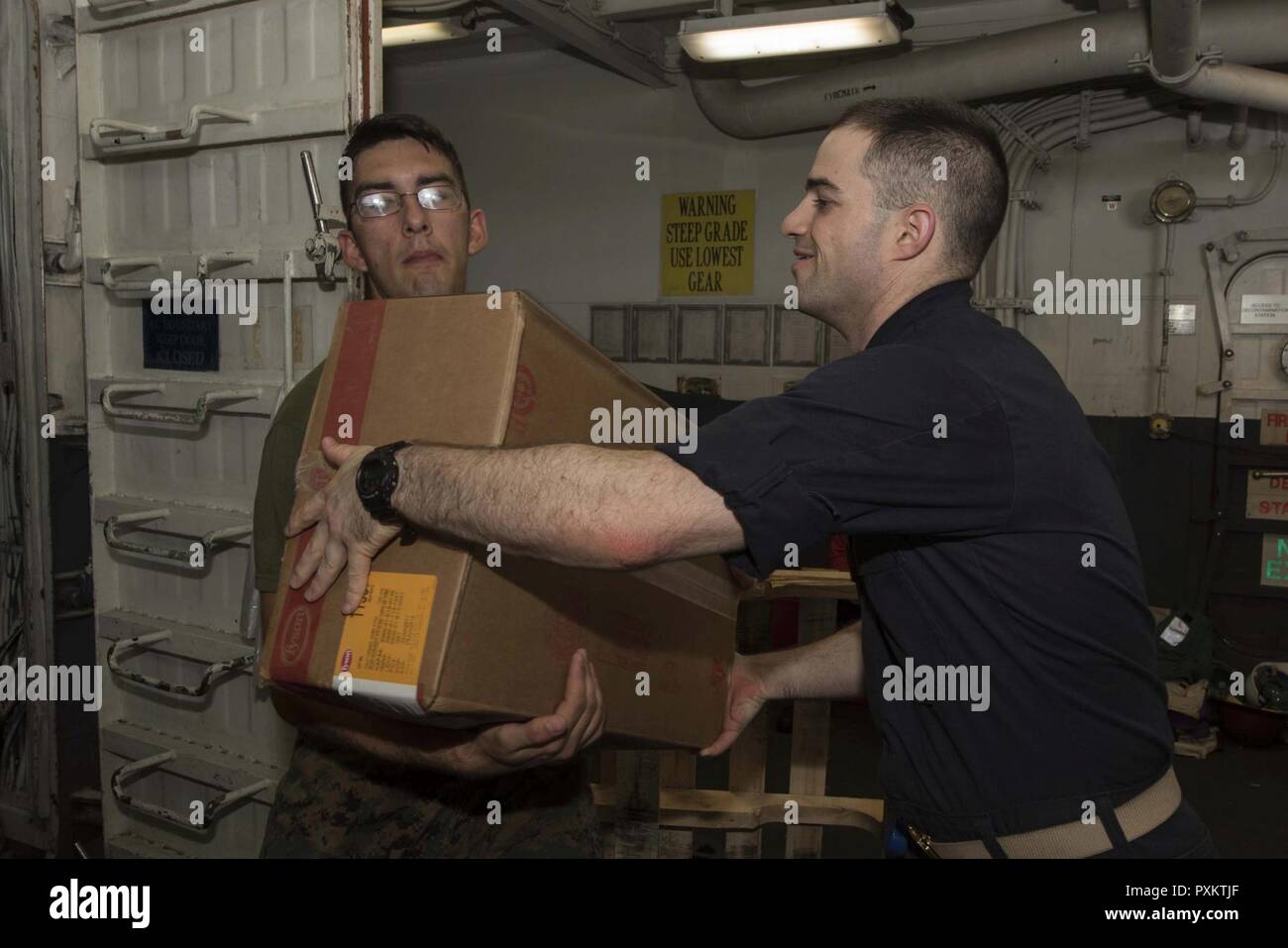 PHILIPPINE SEA (June 16, 2017) Lt.j.g. Bryce Lowry (right), from ...