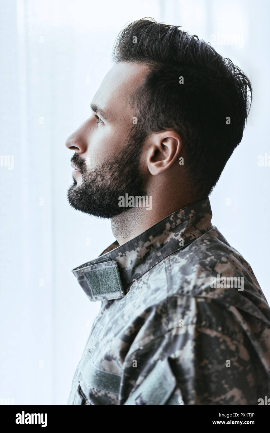 side view of army man in military uniform looking up Stock Photo - Alamy