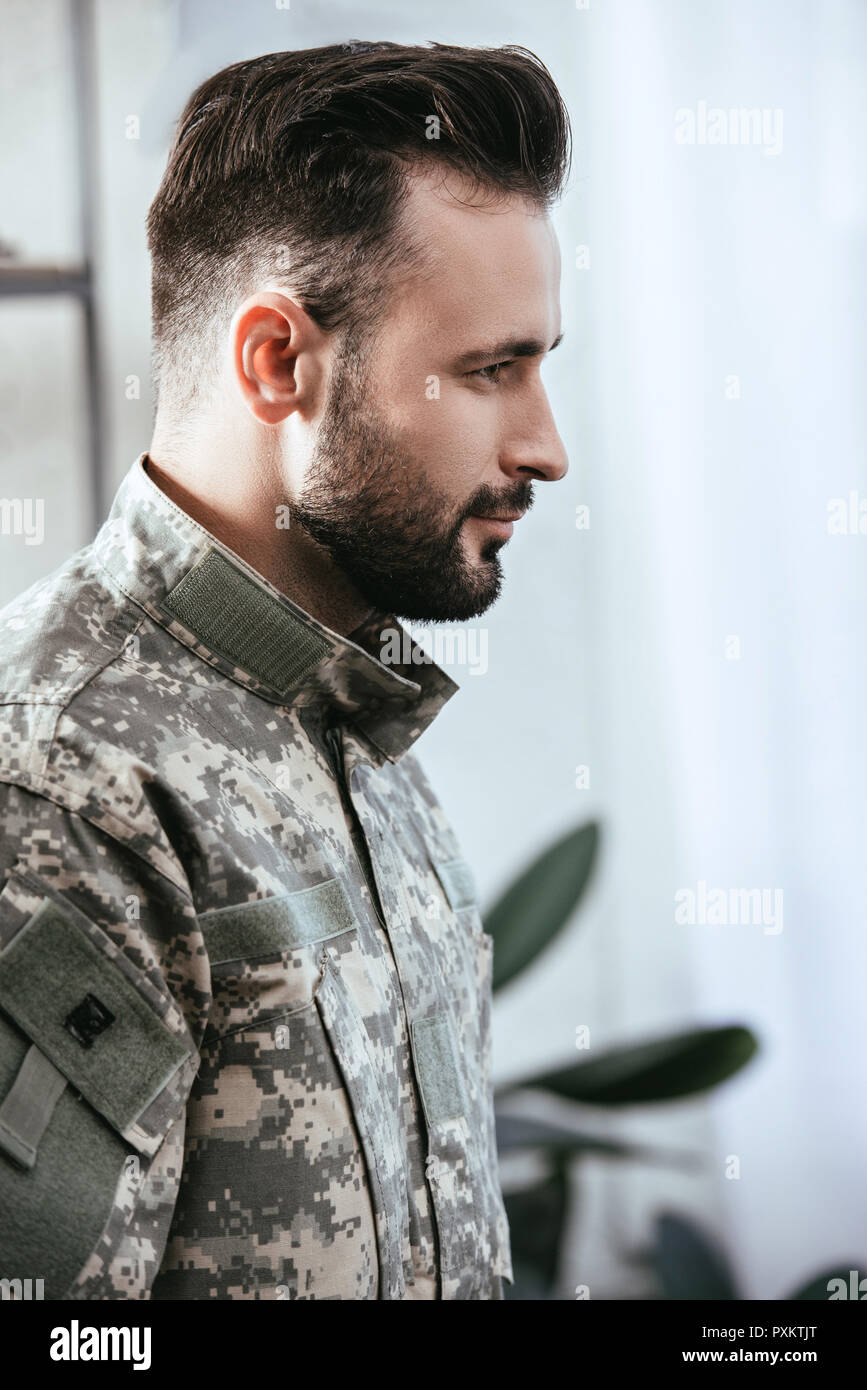 side view of army man in military uniform at home Stock Photo - Alamy
