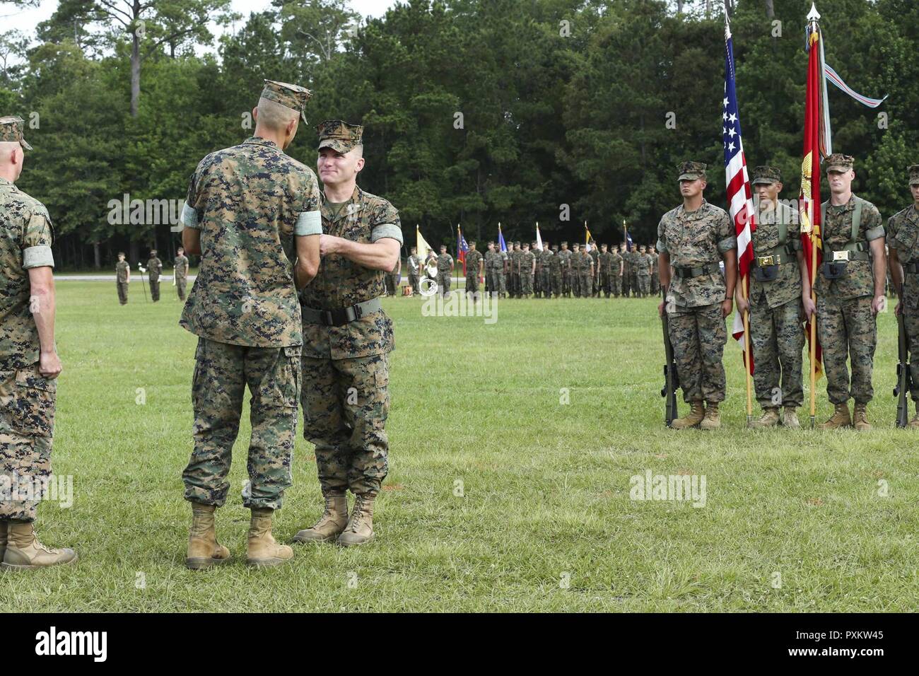 U.S. Marine Corps Lt. Col. Todd B. Sanders receives an award from Col ...
