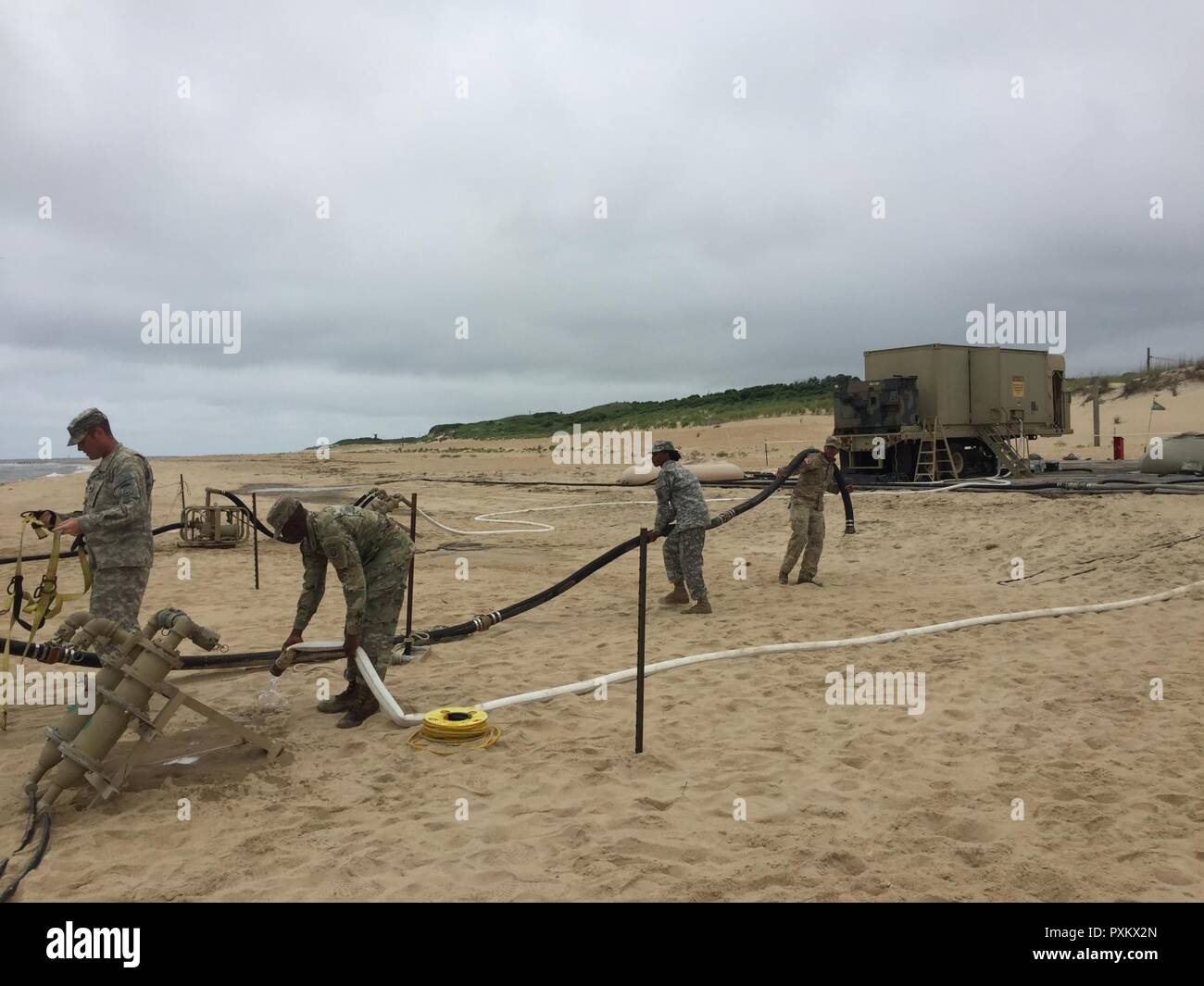 (Left to Right) SGT Christopher Holman, SPC Jeanclimaque Augustin, SPC ...
