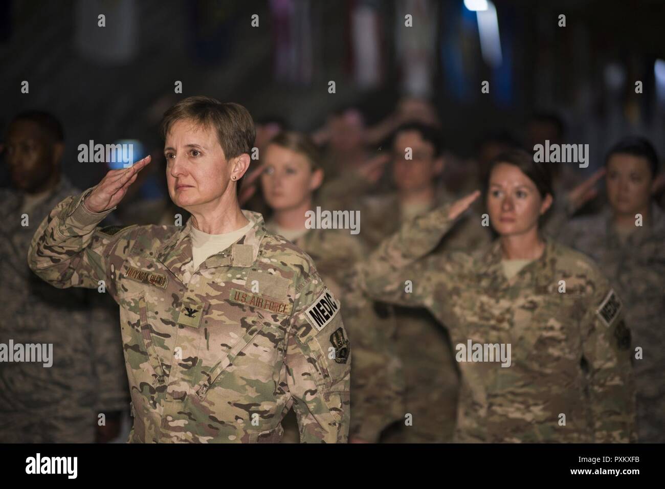 Members of the 332nd Expeditionary Medical Group render a salute to ...