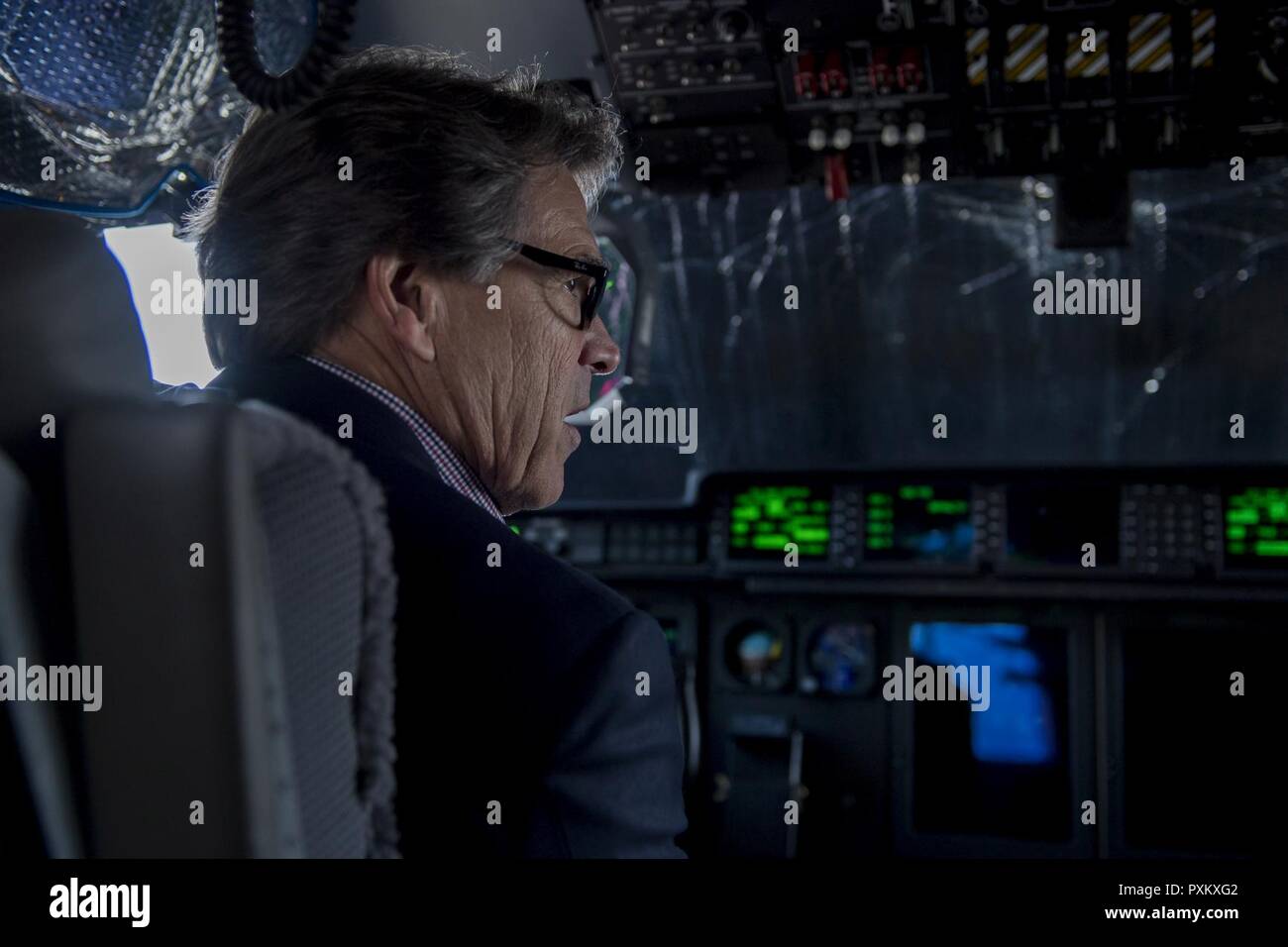 Rick Perry, U.S. Secretary of Energy, sits in the pilot’s seat of a C ...