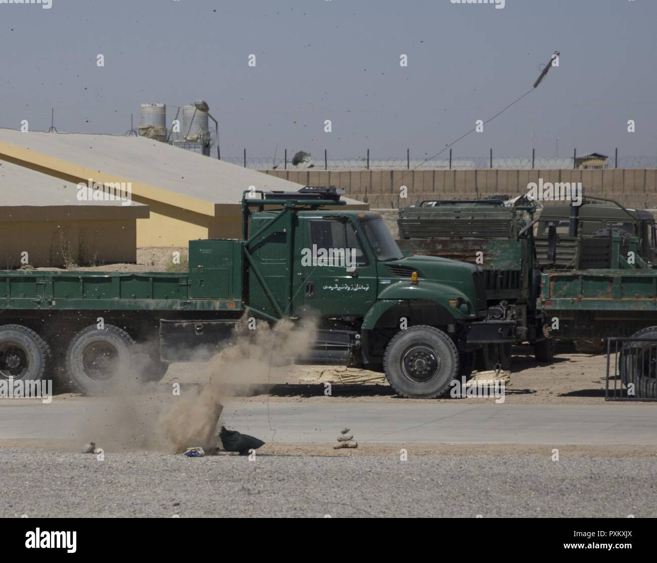 An Afghan engineer with the 505th Zone National Police sets off a ...