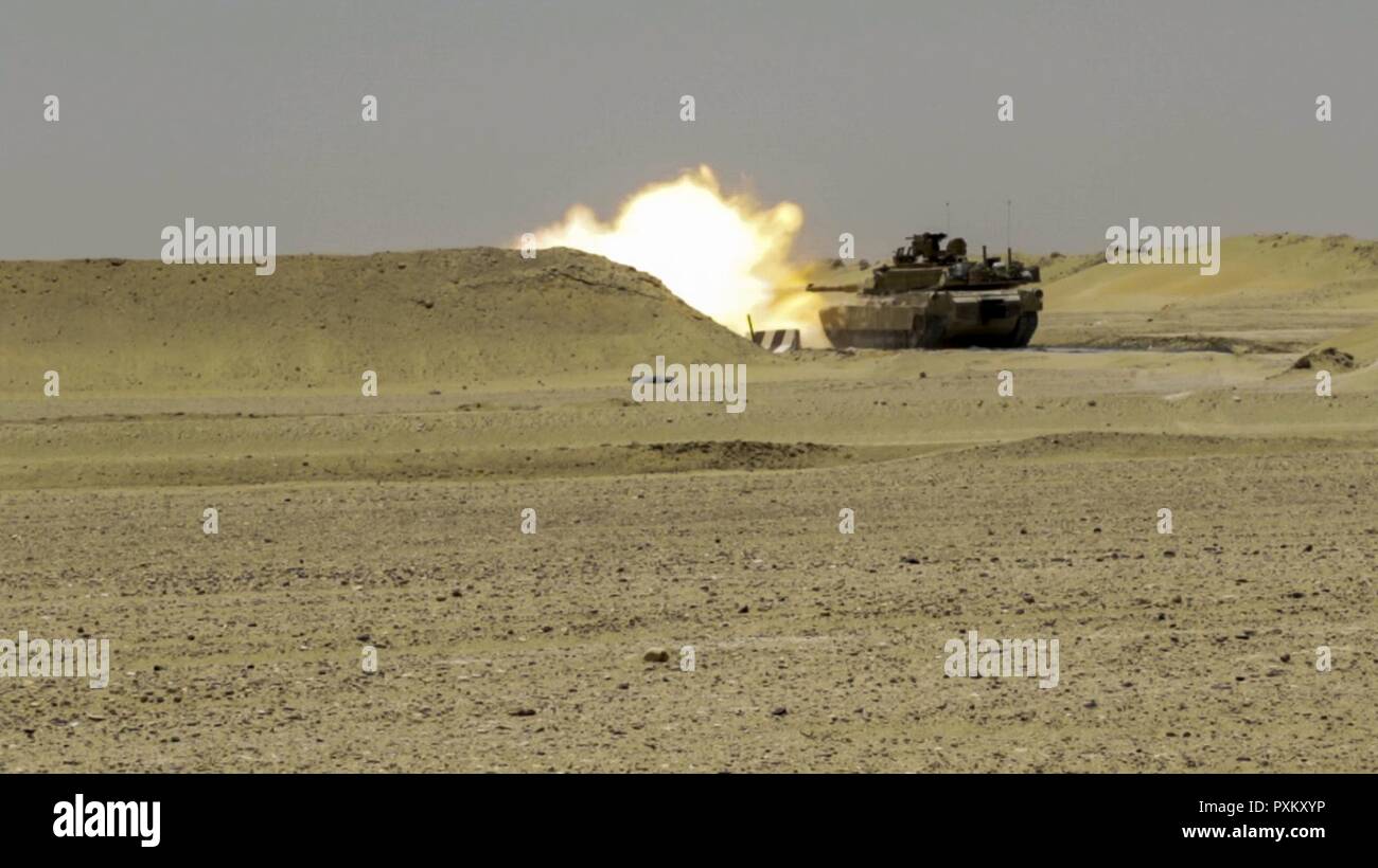 An M1A2 Abrams tank fires a round during Company B, 1st Battalion, 12th ...