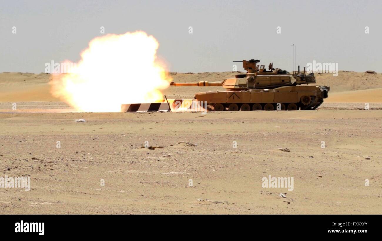 An M1A2 Abrams tank fires a round during Company B, 1st Battalion, 12th ...