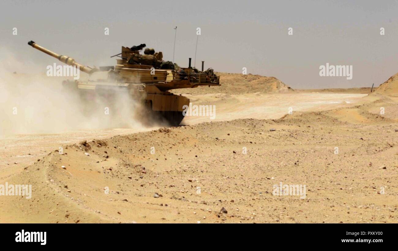 An M1A2 Abrams tank moves toward the firing line during Company B, 1st ...