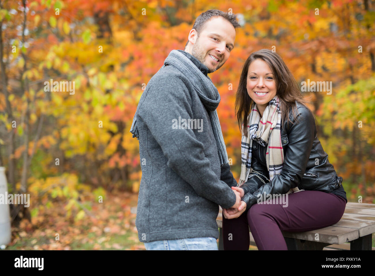 A Young couple in love in a park on a autumn day Stock Photo - Alamy