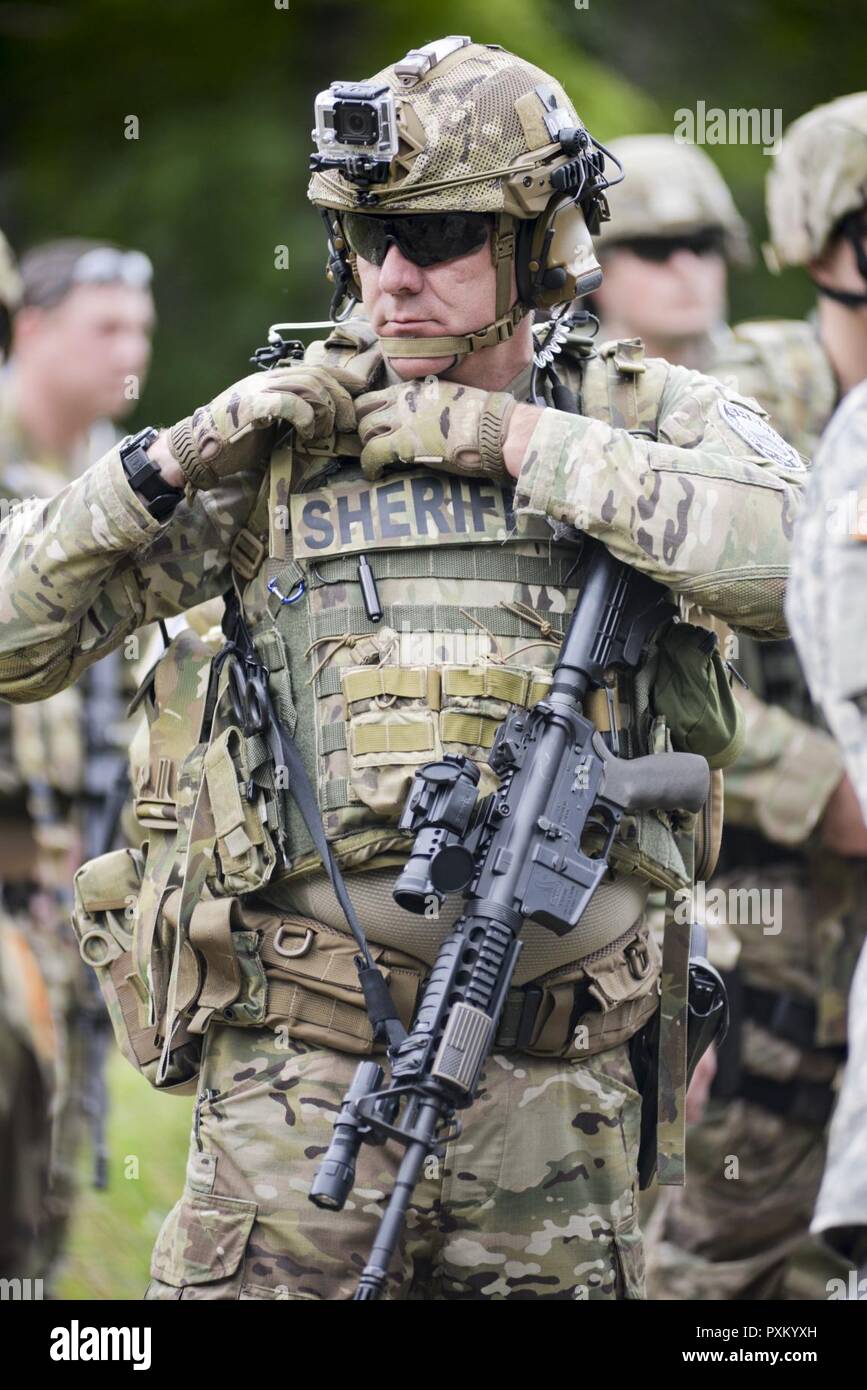 Members of local law enforcement teams gear up in anticipation of ...