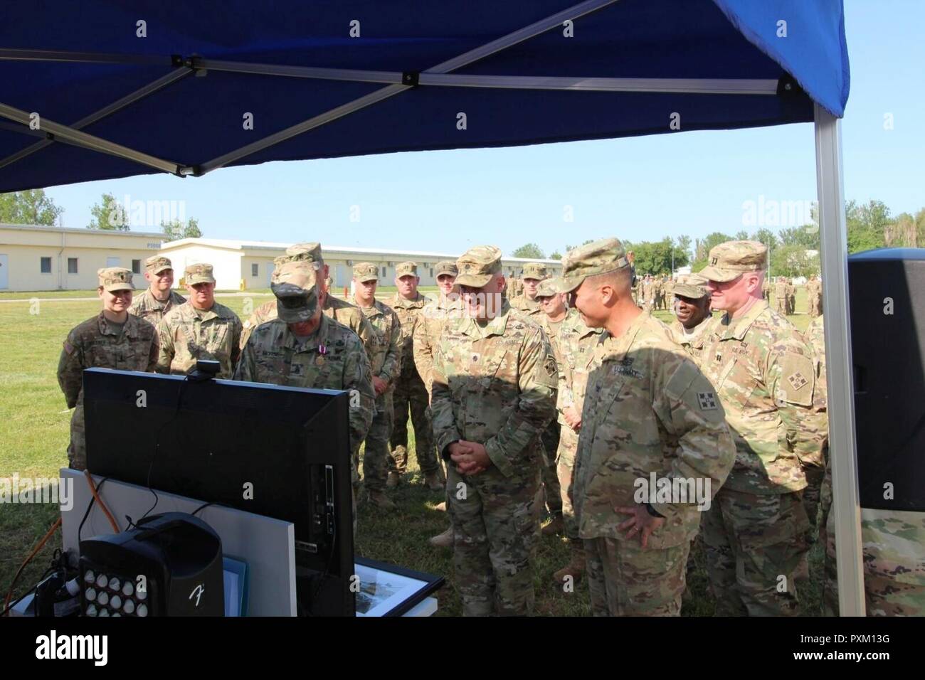 Lt. Col. Jason Sabat (center), outgoing commander of 1st Battalion, 8th ...