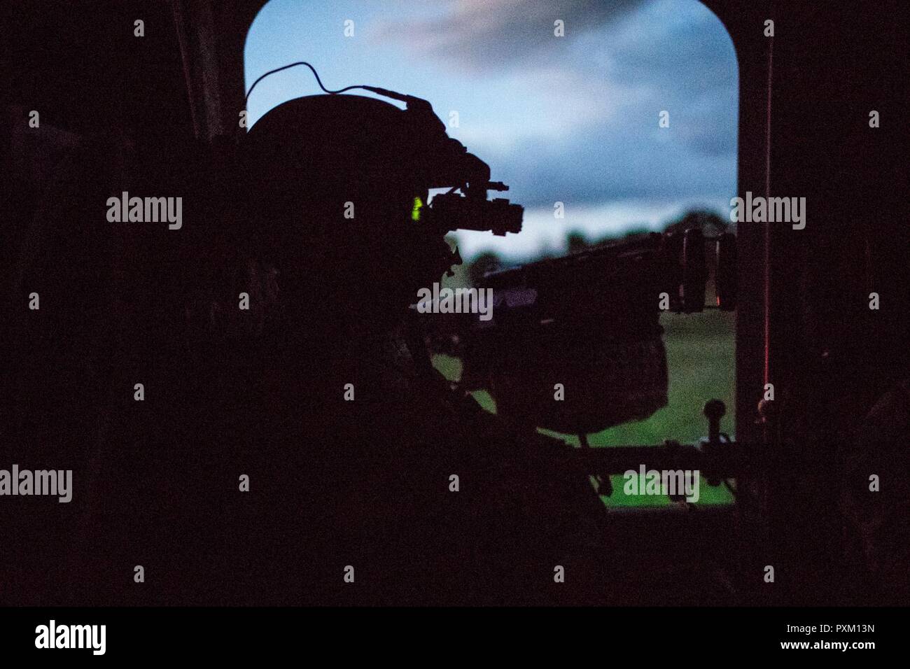 Chinook loadmaster with night vision goggles. American helicopters ...