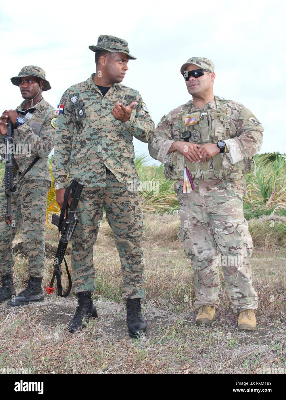 Florida Army National Guard Staff Sgt. Sergio Valdes (right), a Miami ...