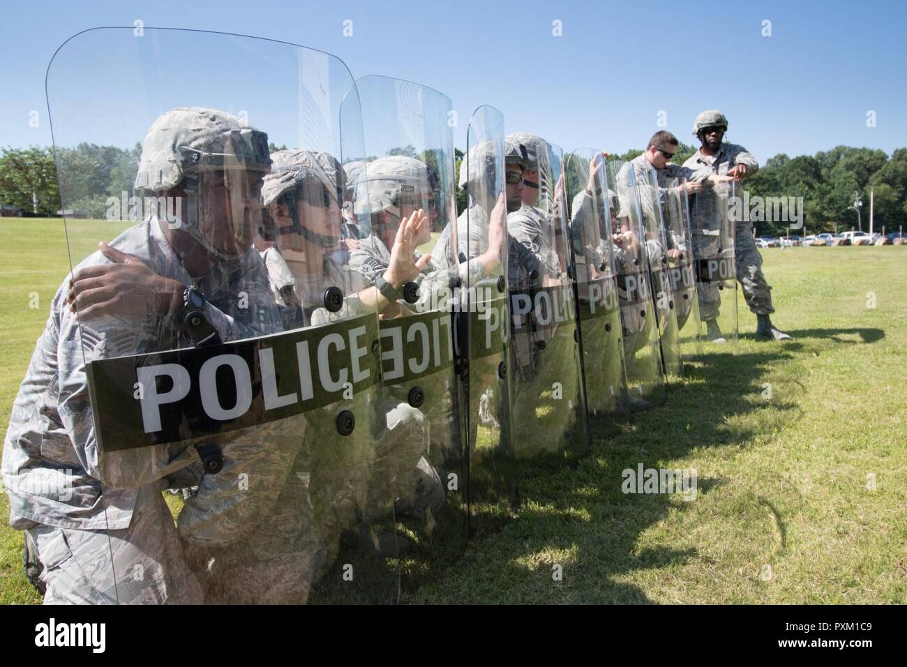Members of the 164th Security Forces Squadron stand fast during ...