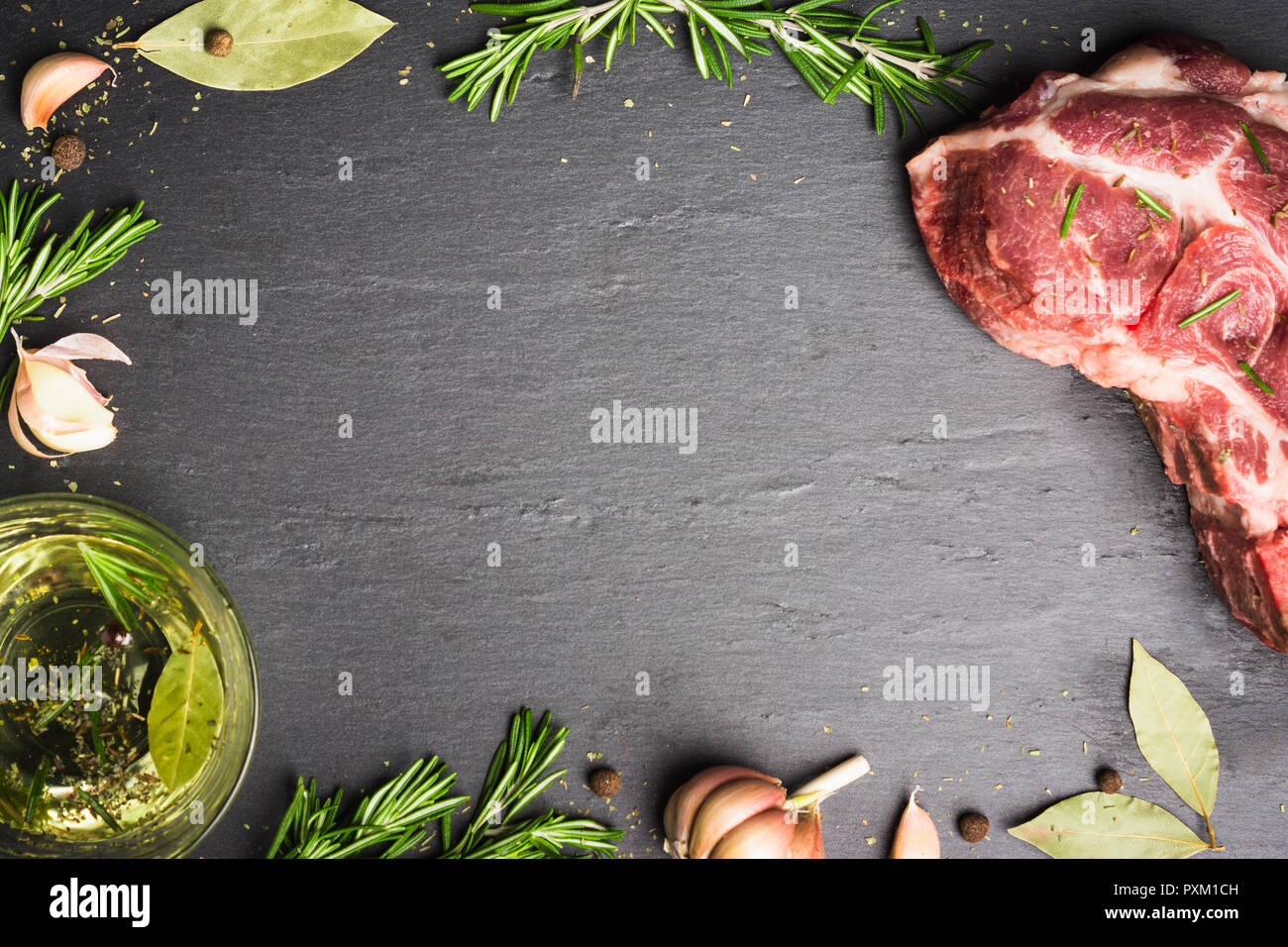 Raw meat and spices on the dark background Stock Photo - Alamy